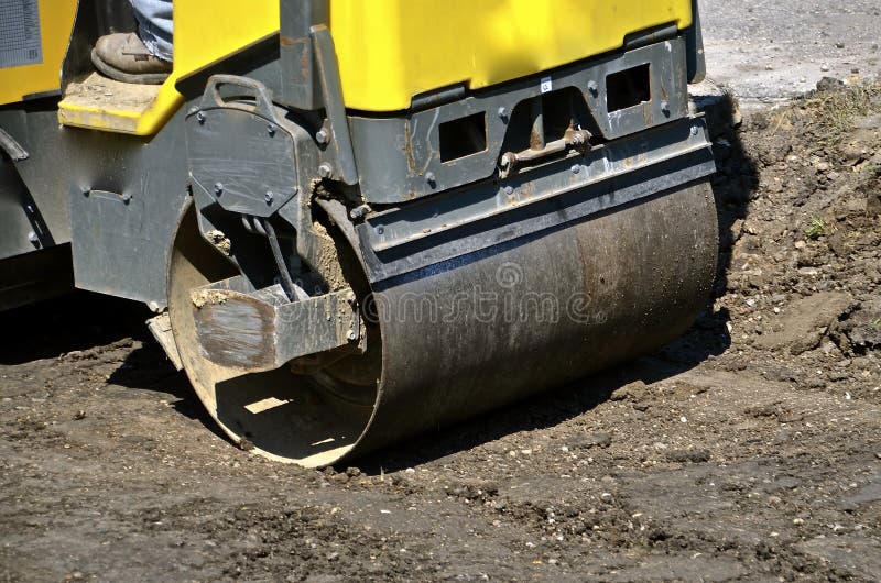 A Large Yellow Packer at a Construction Site Stock Image - Image of ...