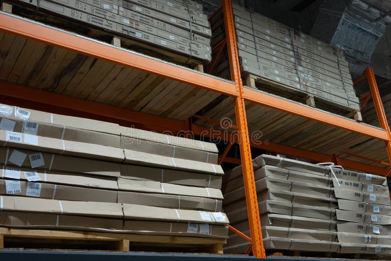 A Large Yellow Rack with Many Cardboard Boxes Stock Photo - Image of ...