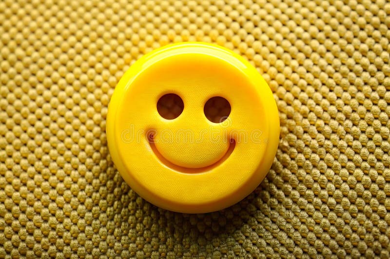A Large Yellow Smiley Face Button Creating a Cheerful and Happy ...