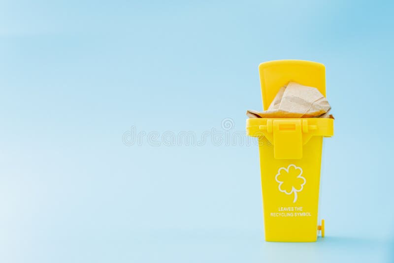 Large Yellow Trash Can Garbage Bin with Wheel on Blue Background Stock ...
