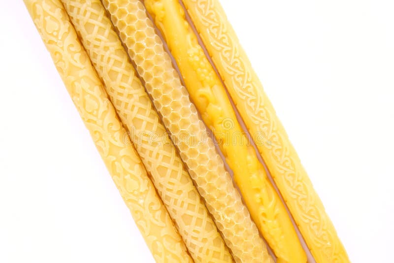Large Yellow Candles with Different Cut Patterns on White Stock Photo ...