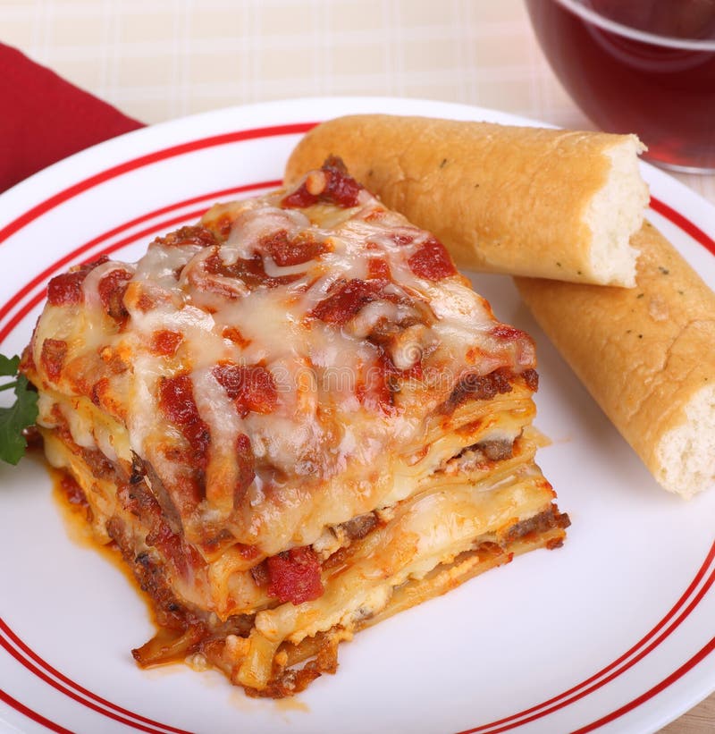 Lasagna Dinner stock image. Image of dinner, bread, cheesy - 39659991