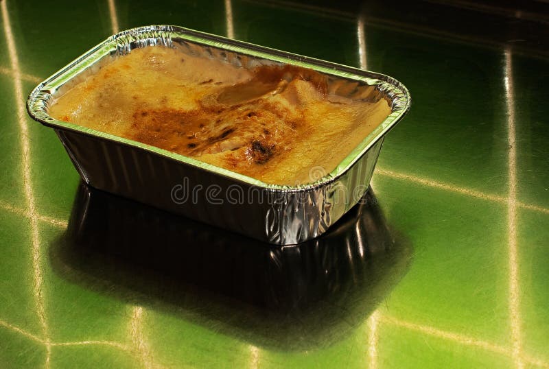 Lasagna in foil container stock image. Image of convenience - 16634557