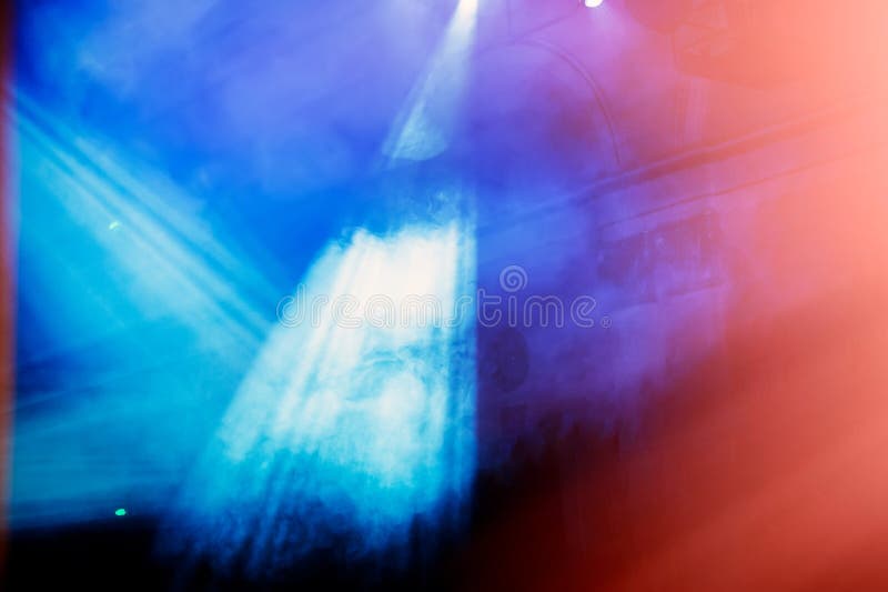 Laser Beams Illuminate the Scene in a Haze during the Performance Stock ...