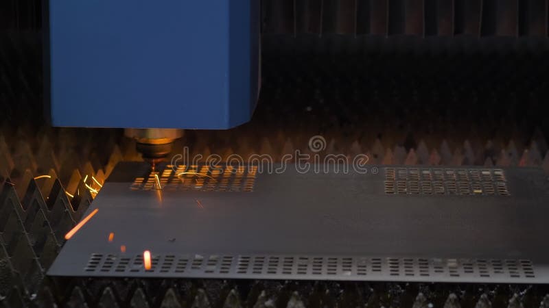 Laser Cutting Machine is Operating on Sheet Metal with Sparks Stock ...