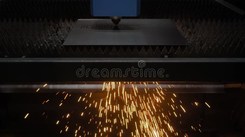 Laser Cutting Machine is Operating on Sheet Metal with Sparks Stock ...