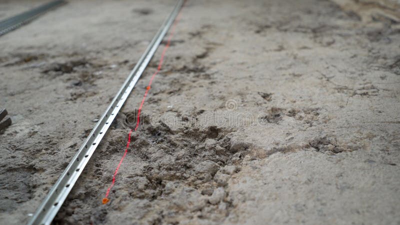 Laser Level Emitting Red Beam on Construction Site with Metal Profile ...