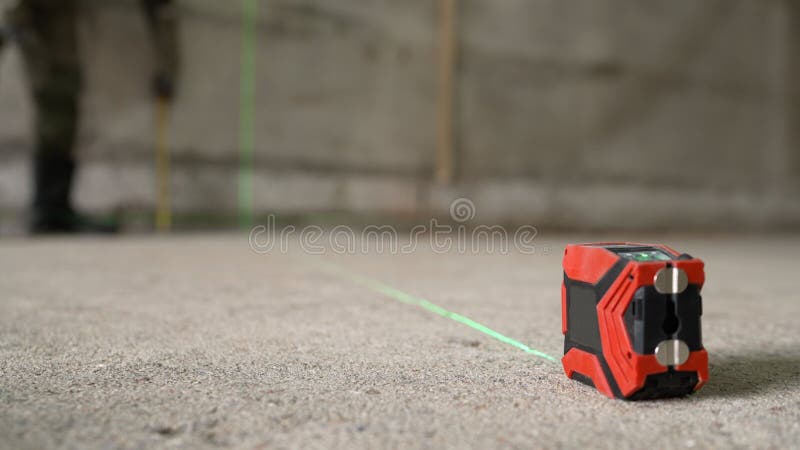 A Laser Level Marks Out Lines for Markings on a Construction Site. a ...