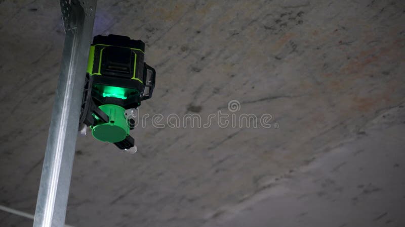The Laser Level Projects a Bright Green Line Onto a Smooth White ...
