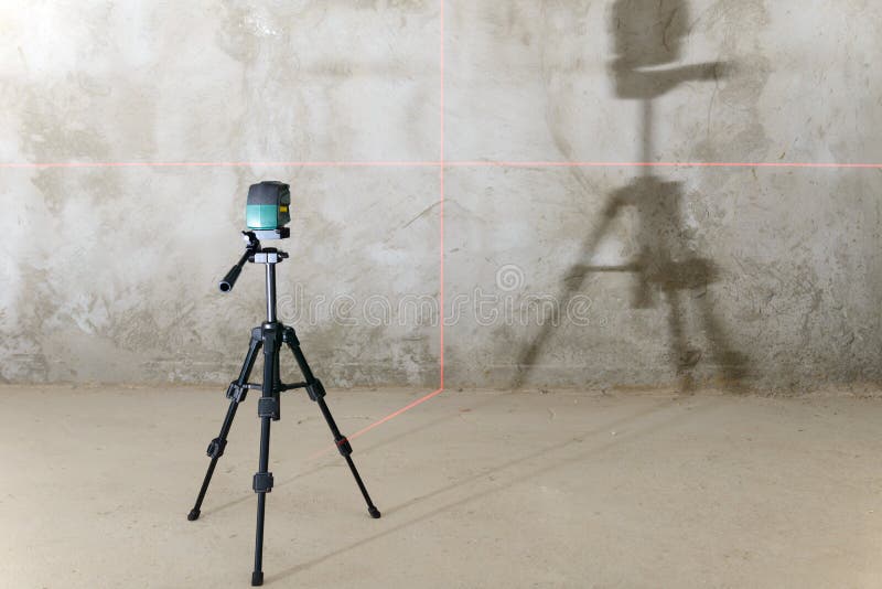 Laser Level Projects Red Lines Onto the Wall with a Rough Finish Stock ...