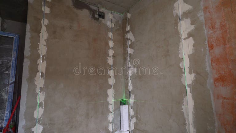 Laser Level Tool Projecting Green Lines on Wall during Renovation Stock ...