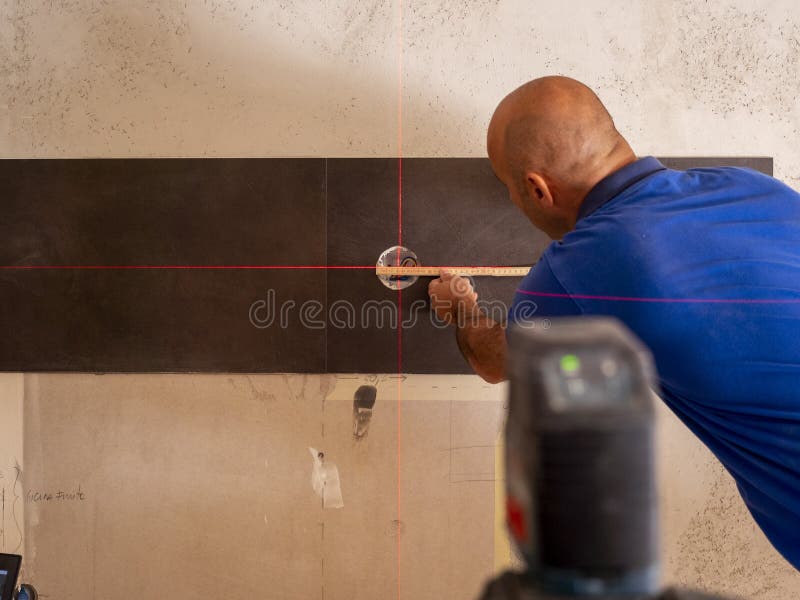 Laser level on the wall stock image. Image of instrument - 201021671