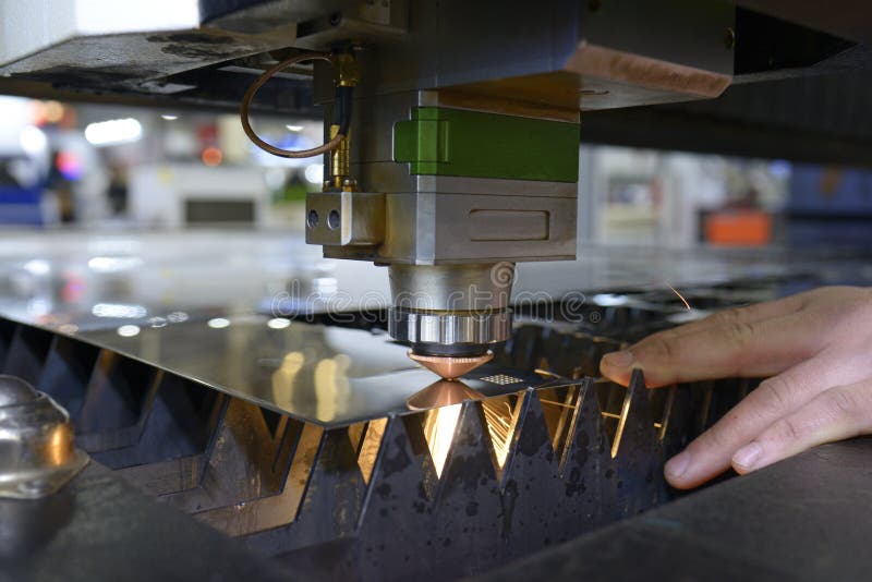 Laser Machine Cutting Metal Sheet, Worker Hand Taking Control, Sparks ...