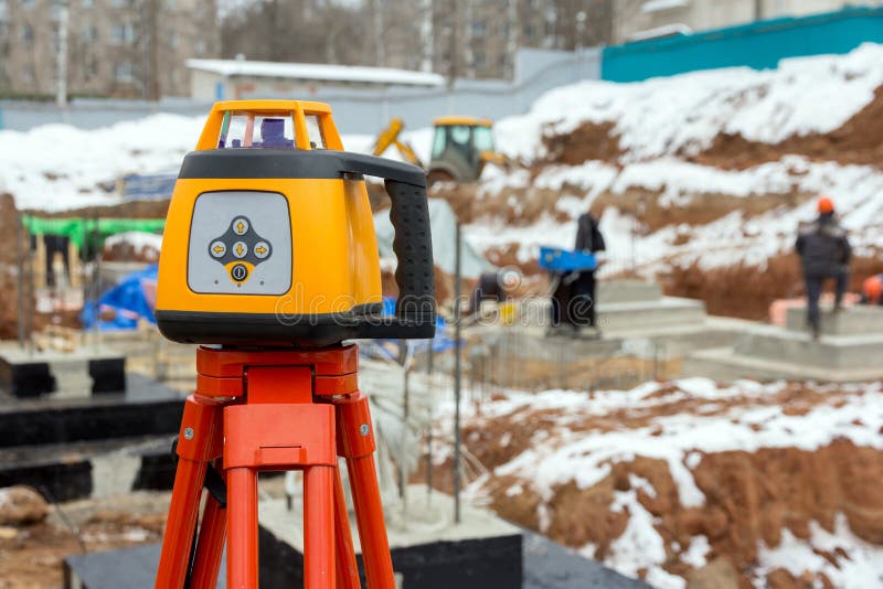Laser Rangefinder at a Construction Site. Measuring Tool at a ...