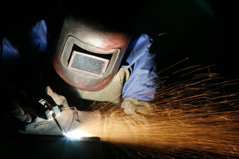 Lasser op het werk stock afbeelding. Image of vonk, lasser - 5397595