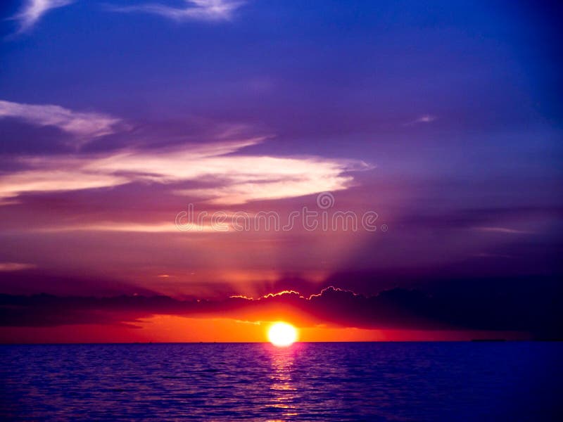 Last Light Sunset on the Dark Blue Sea and Gray Blue Sky Stock Image ...
