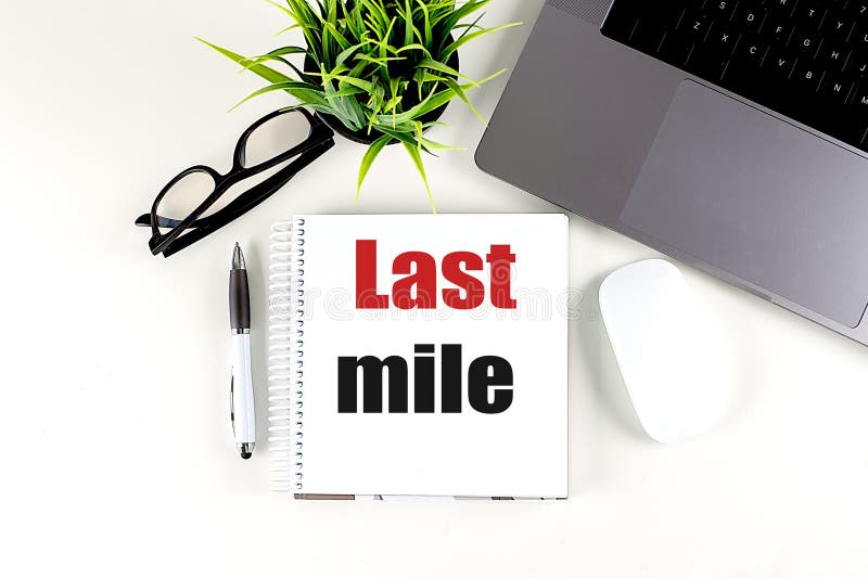 LAST MILE Text on Notebook with Laptop, Mouse and Pen Stock Photo ...