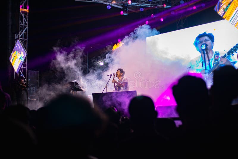 Lively Concert Crowd with Hands in the Air Enjoying a Music Festival ...