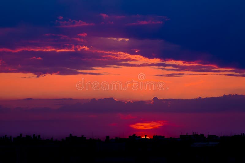 Last Rays of the Sun at Sunset Over the City Rooftops Stock Image ...