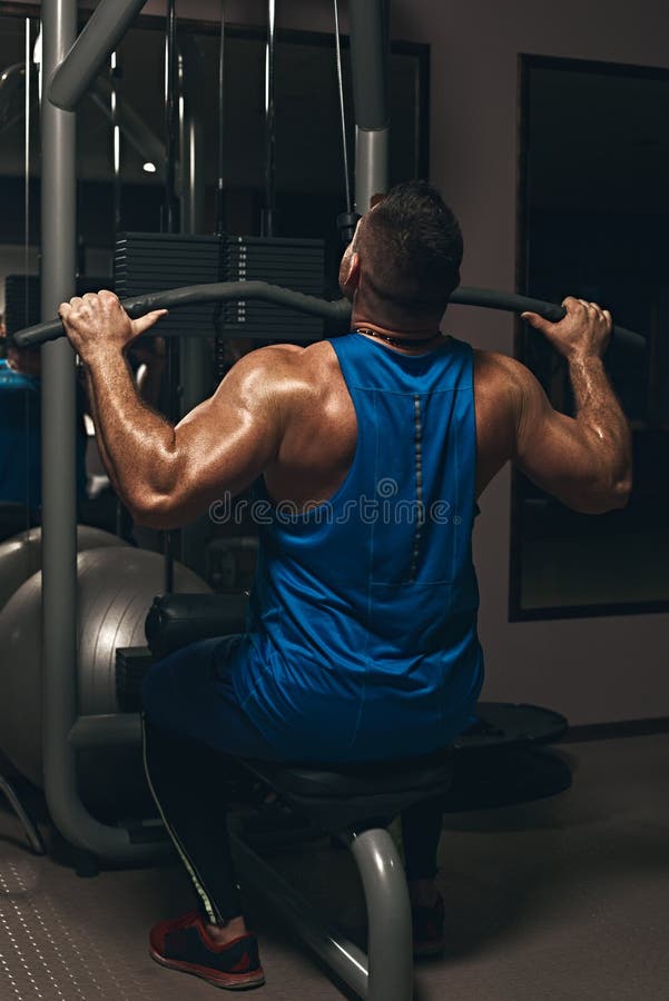 Lat pulldown exercise stock image. Image of athletic - 175486749
