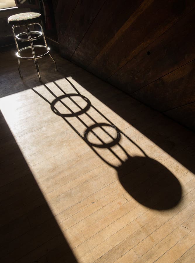 Long shadow, bar stool stock image. Image of interesting - 104717131