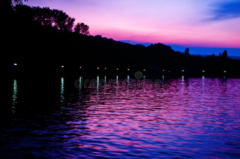 Late Autumn Sunset in a City Park with Reflection in the Water Stock ...