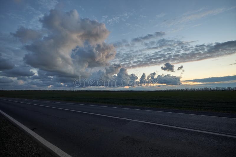 Empty Asphalt Highway Against the Bright Sun at Sunse Stock Image ...