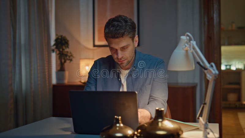 Late Worker Open Laptop at Evening Flat Closeup. Serious Man Writing ...