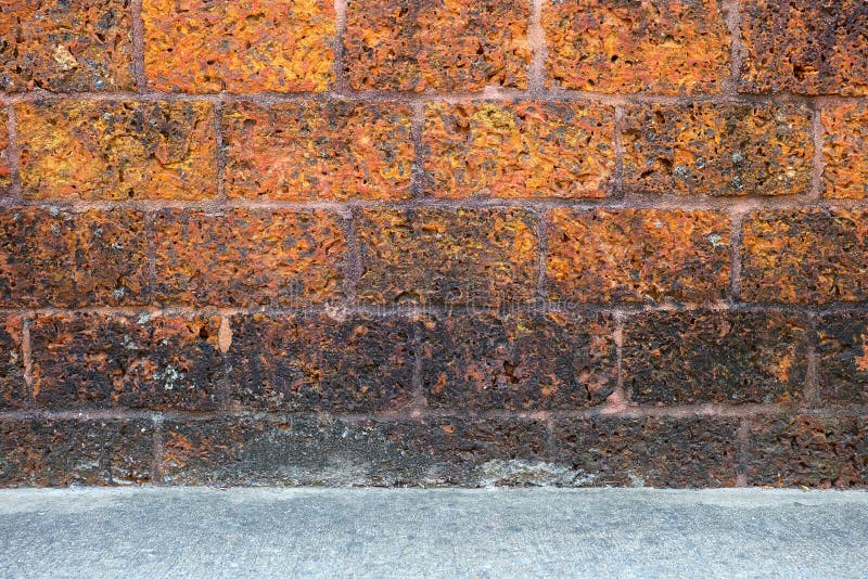 Laterite Brick Wall Texture Background with Concrete Ground. Stock ...