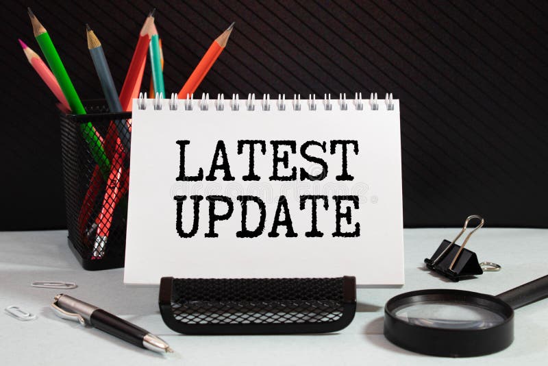 LATEST UPDATE Appearing Behind Torn Paper.Business Concept. Stock Image ...