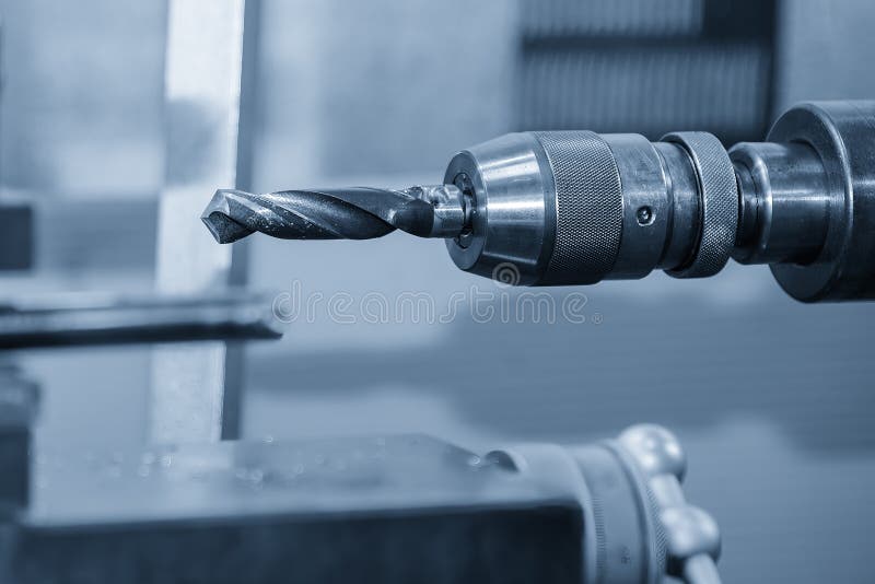 The Lathe Machine Drilling Process the Metal Parts in the Light Blue ...