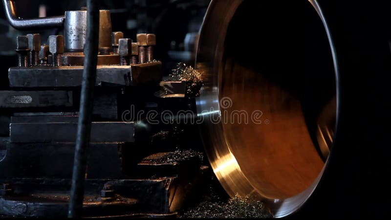 A Lathe Processes a Metal Workpiece. Heavy Industry Manufacturing ...