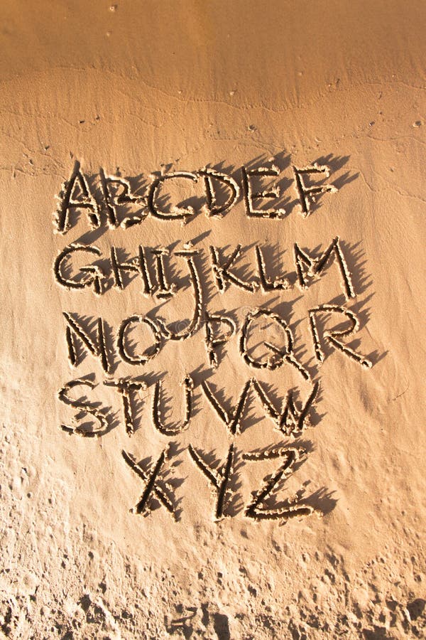 Latin Alphabet Handwriting on the Sand. Stock Photo - Image of ...