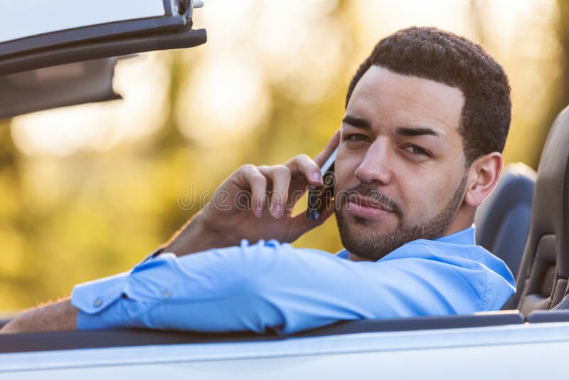 Latin American Driver Making a Phone Call while Driving Stock Photo ...