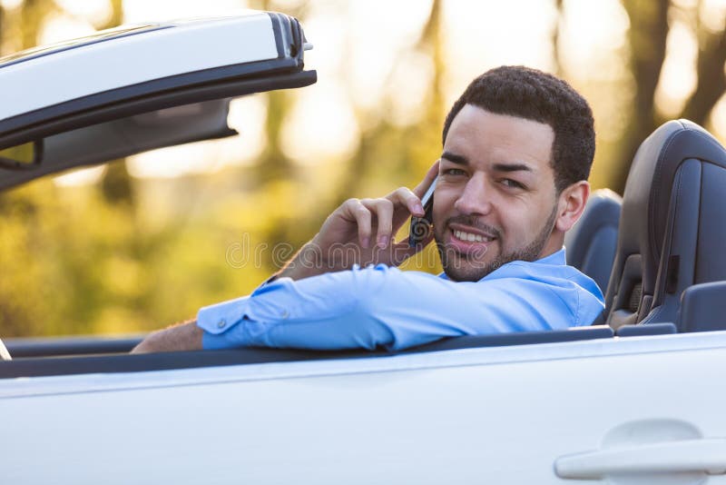 Latin American Driver Making a Phone Call while Driving Stock Image ...