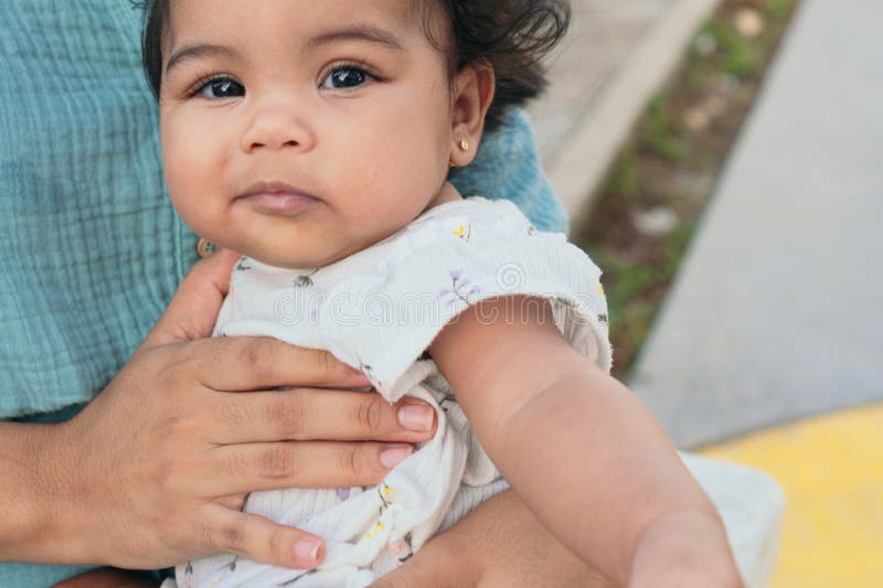 Latin Baby Looking at Camera Outdoors Stock Photo - Image of park ...