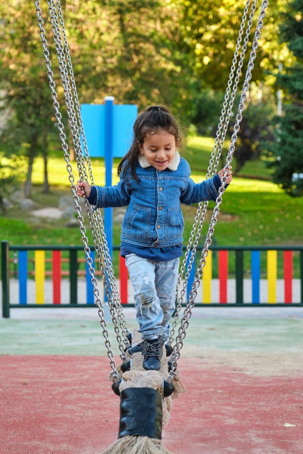 Latin Boy Playing Balance on a Rope at a Playground. Stock Image ...