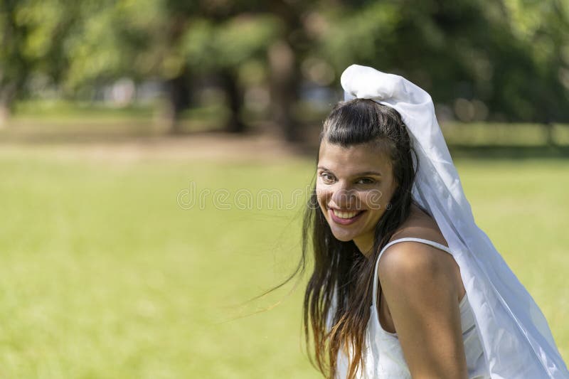Latin Bride in a White Wedding Dress in a Park Stock Image - Image of ...