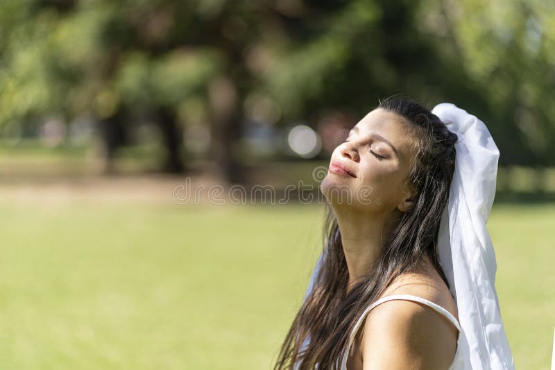 Latin Bride in a White Wedding Dress in a Park Stock Image - Image of ...
