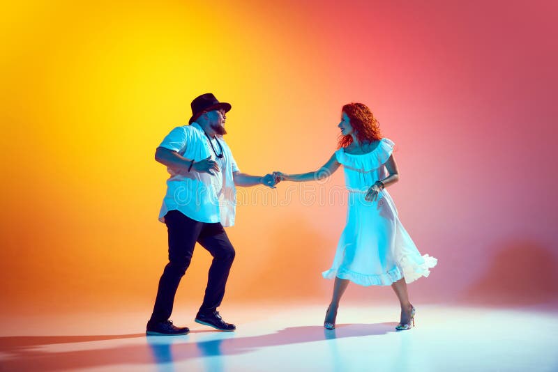 Latin Dancers Perfect Their Salsa Routine, Focusing on Each Step S ...