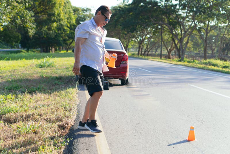 Latin Man Putting Up the Orange Cone Road Sign Stock Photo - Image of ...