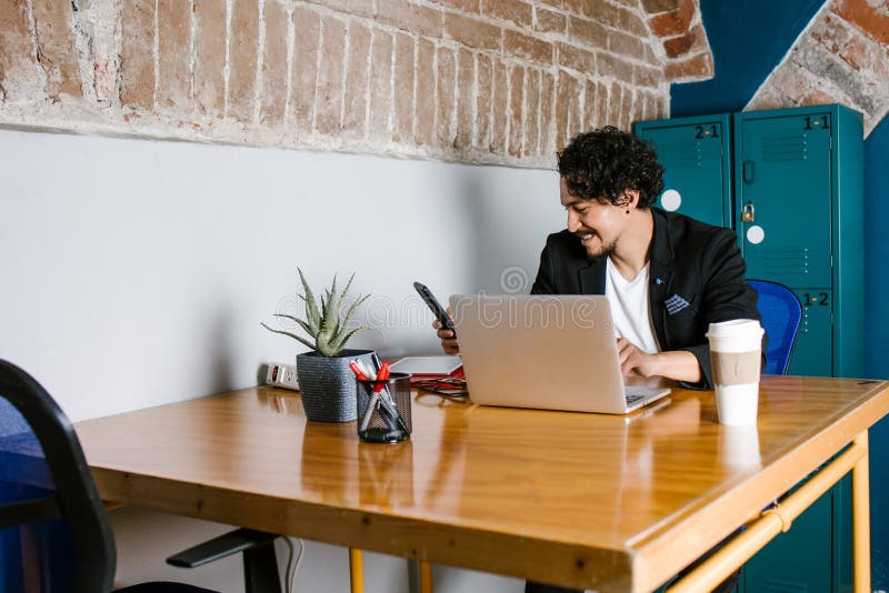 Latin Man Working with Computer at Office in Mexico City Stock Photo ...