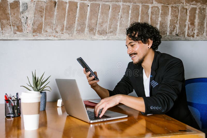 Latin Man Working with Computer at Office in Mexico City Stock Image ...
