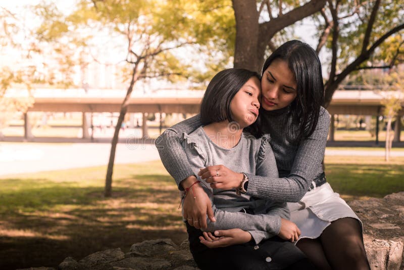 Latin Mother Consoling Her Sad Daughter Outside Stock Image - Image of ... Latin Mother Consoling Her Sad Daughter Outside Stock Image - Image of ...