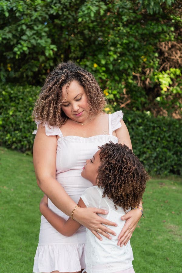 Latin Mother and Daughter Spend Time Together Outdoors Stock Photo ...