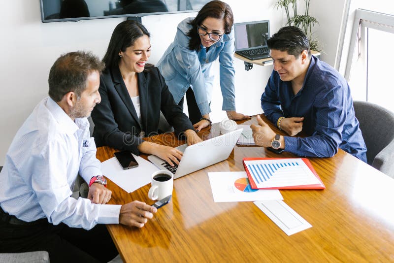 Latin Office Workers Sitting Working Online with Digital Devices in ...