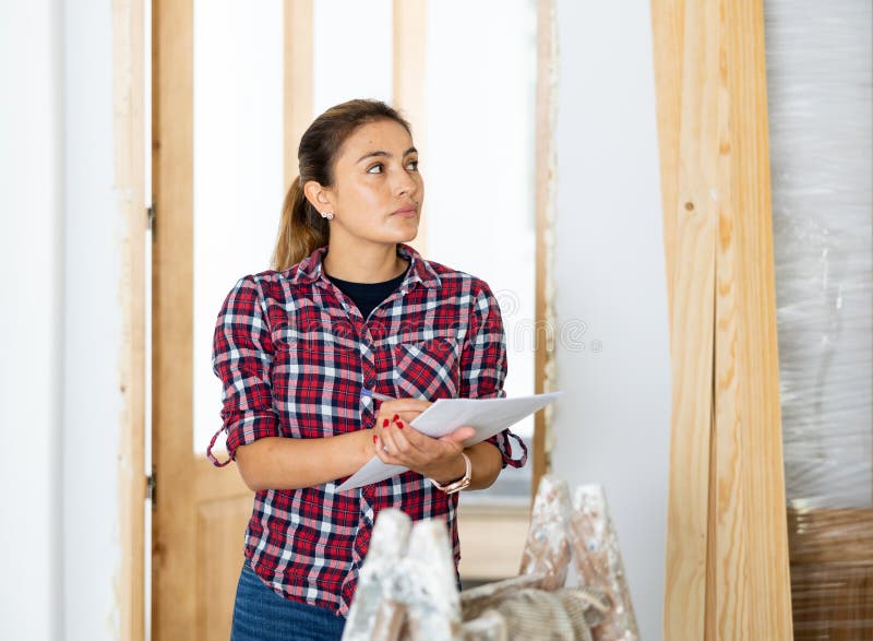 Woman Checking Documents Inside New Apartment Stock Image - Image of ... Woman Checking Documents Inside New Apartment Stock Image - Image of ...