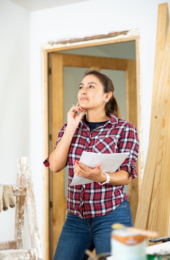 Woman Inspecting Rooms in Building Site, Checking Documents Stock Image ...
