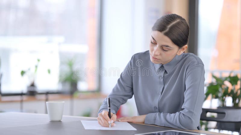 Latin Woman Writing on Paper in Office Stock Image - Image of latin ...