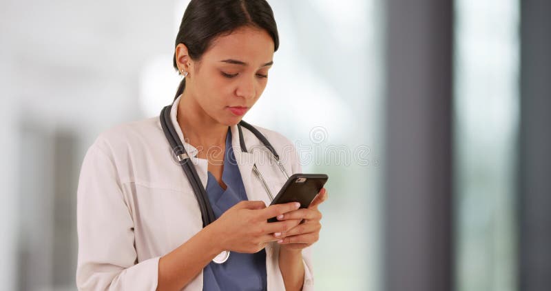 Doctor Texting on a Cell Phone Stock Image - Image of facial, doctor ...